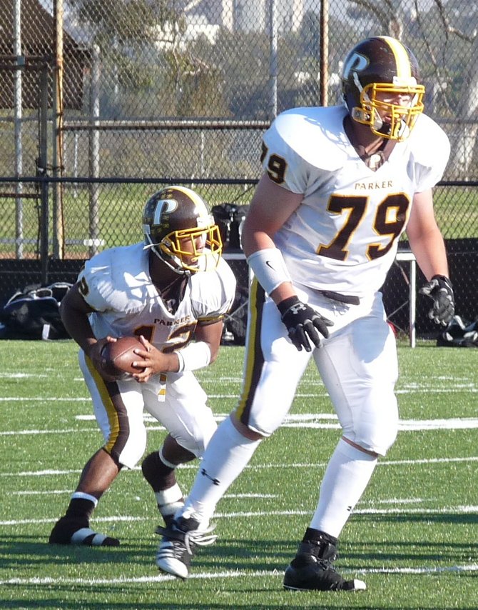 Photo: Lancers quarterback Deon Randall takes off from the pocket ...