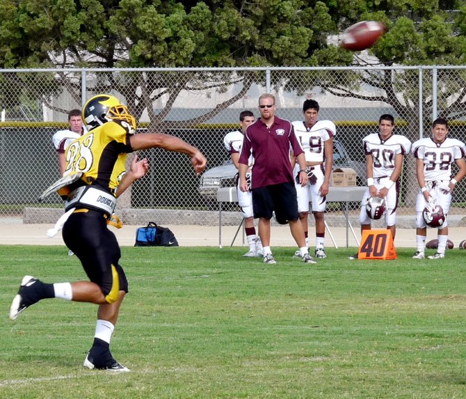 Photo: Mission Bay quarterback Dillon Baxter fires a pass downfield ...