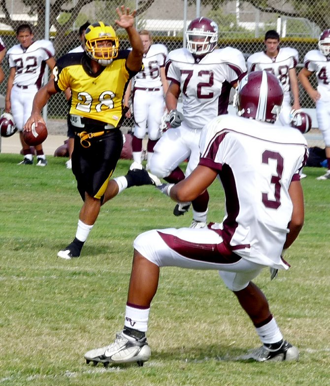 Photo: Mission Bay quarterback Dillon Baxter directs his receivers from ...