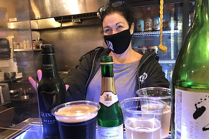 Photo: Susan brings our grog, Guinness ($2!), and two small bottles of ...