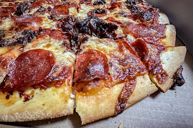 Photo: Square cut, thin crust pizza with pepperoni and Italian beef ...