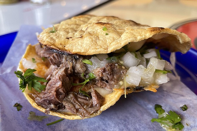 Photo: A vampiro style taco, made with melted cheese and wavy/crispy ...